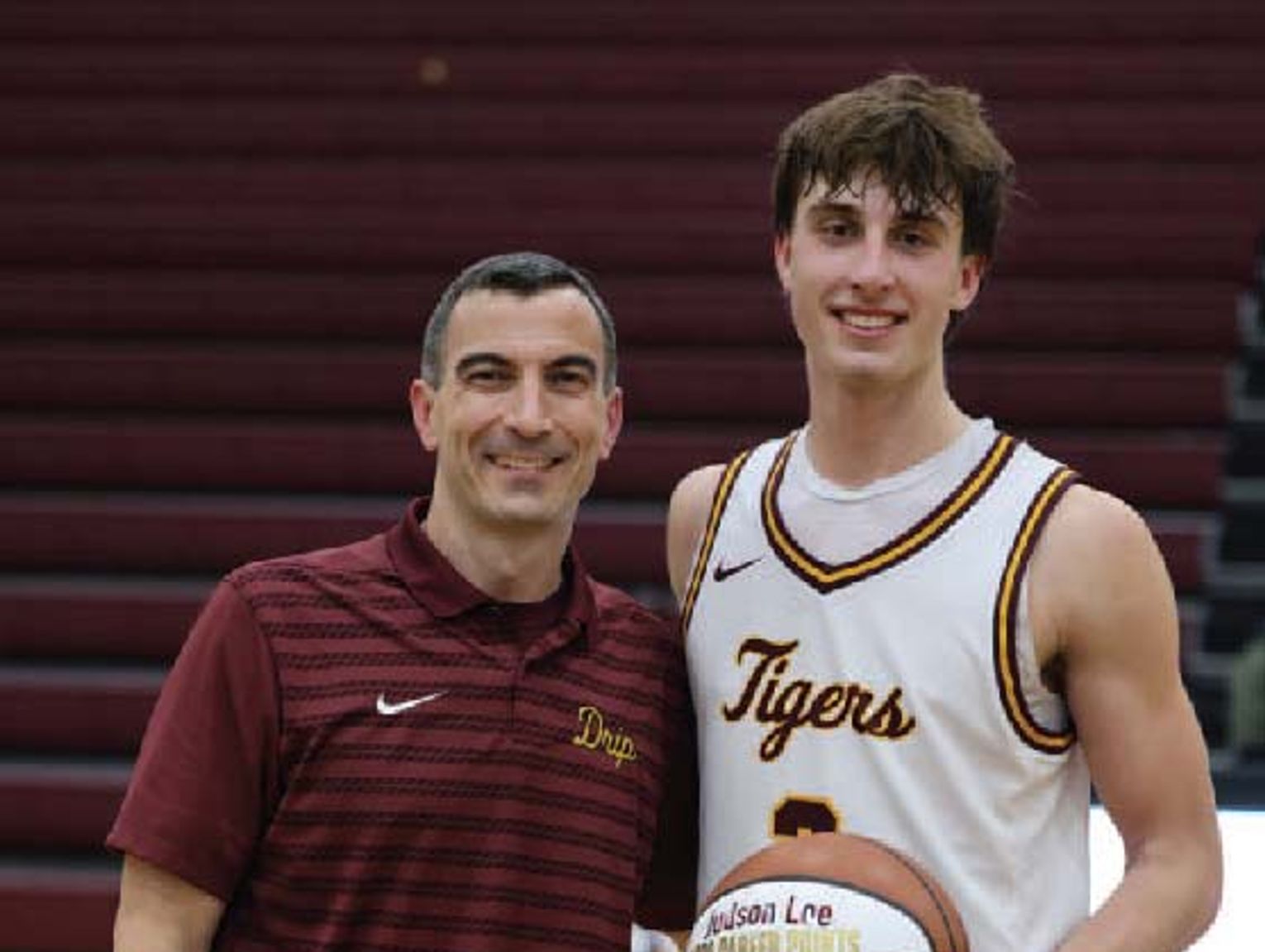 Tigers win opener, Loe tops 1000